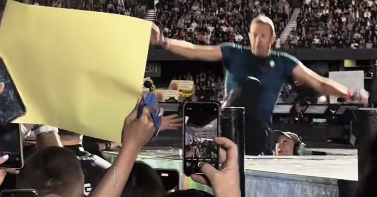 Chris Martin falls through an open trap door on stage during Coldplay's ...