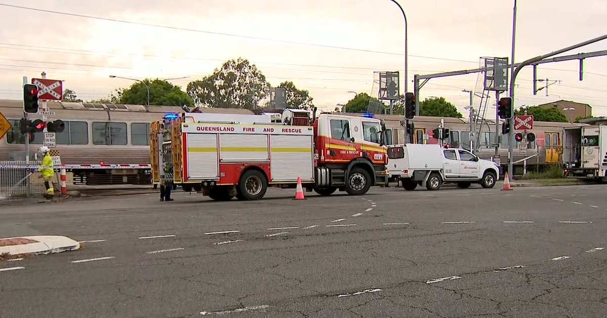 Runcorn: Cyclist dies in collision with train in Brisbane