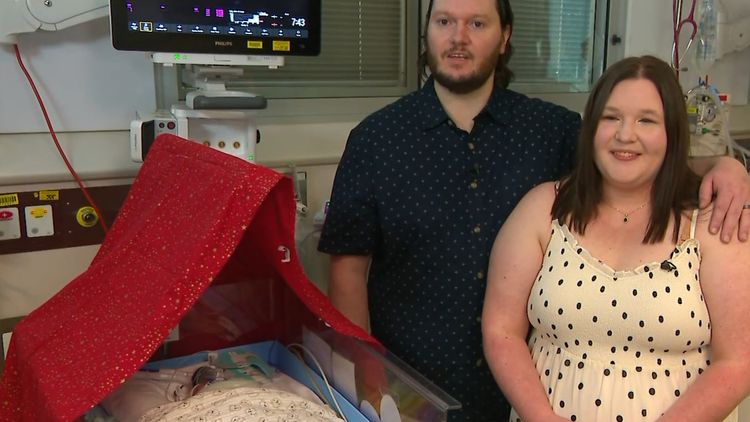 Tiny newborn Charlie breaks record as Queensland's smallest baby