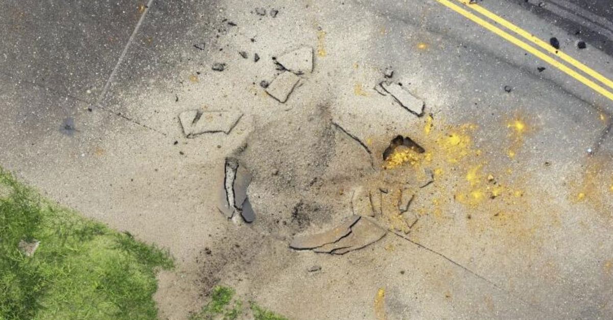 World War II bomb explodes at a Japanese airport, causing large crater ...