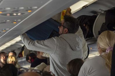 Opinion: The considerate traveller's guide to overhead bin etiquette ...